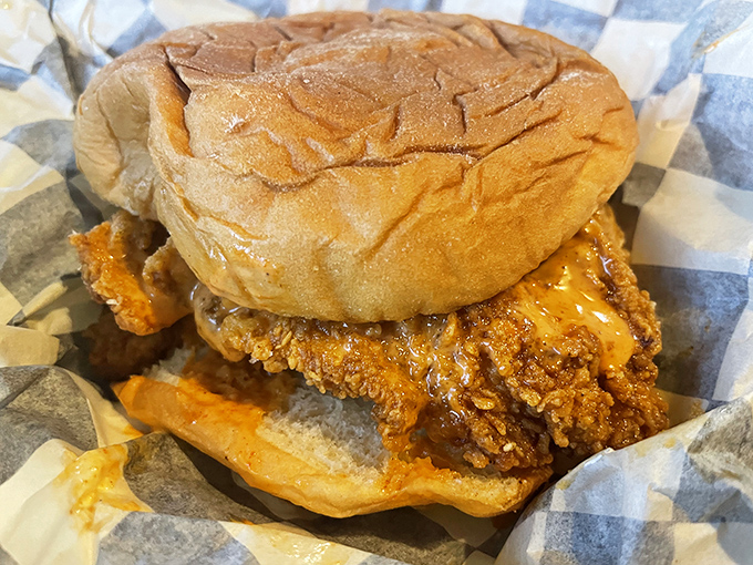 The sandwich that launched a thousand road trips: perfectly fried chicken nestled in a soft bun, ready to deliver that signature Prince's heat experience.