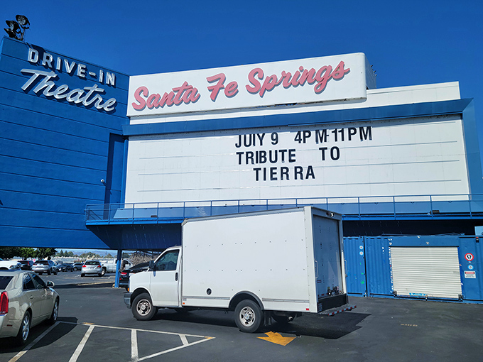 The drive-in marquee stands as a nostalgic reminder of simpler times. By day, swap meet paradise; by night, a cinematic journey under the stars.