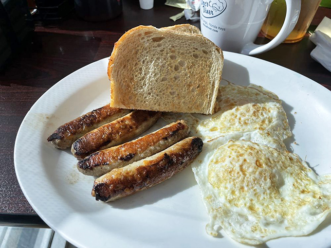 Sometimes perfection is simple – perfectly browned sausage links, eggs with just-right yolks, and toast ready for that essential butter smear.