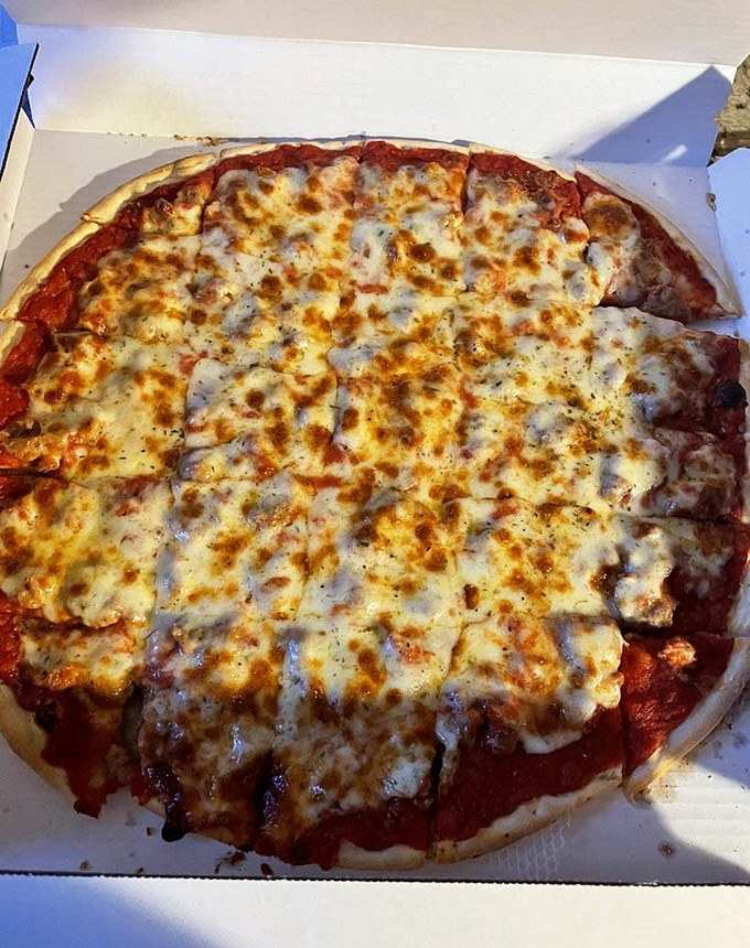 This sausage pizza isn't trying to impress you with fancy toppings&mdash;it's confident in its perfect ratio of sauce, cheese, and crust.