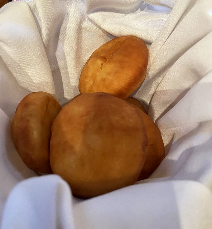 These aren't just scones&mdash;they're pillowy golden miracles that have launched a thousand road trips. The honey butter is non-negotiable.