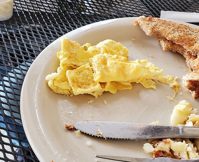 Scrambled eggs so fluffy they could practically float off the plate. The toast? Just a landing pad for butter enthusiasts.