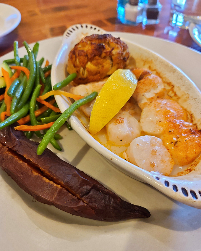 Perfectly seared scallops nestled beside a crab cake that's more crab than cake &ndash; this plate is Virginia Beach's answer to "What does happiness look like?"