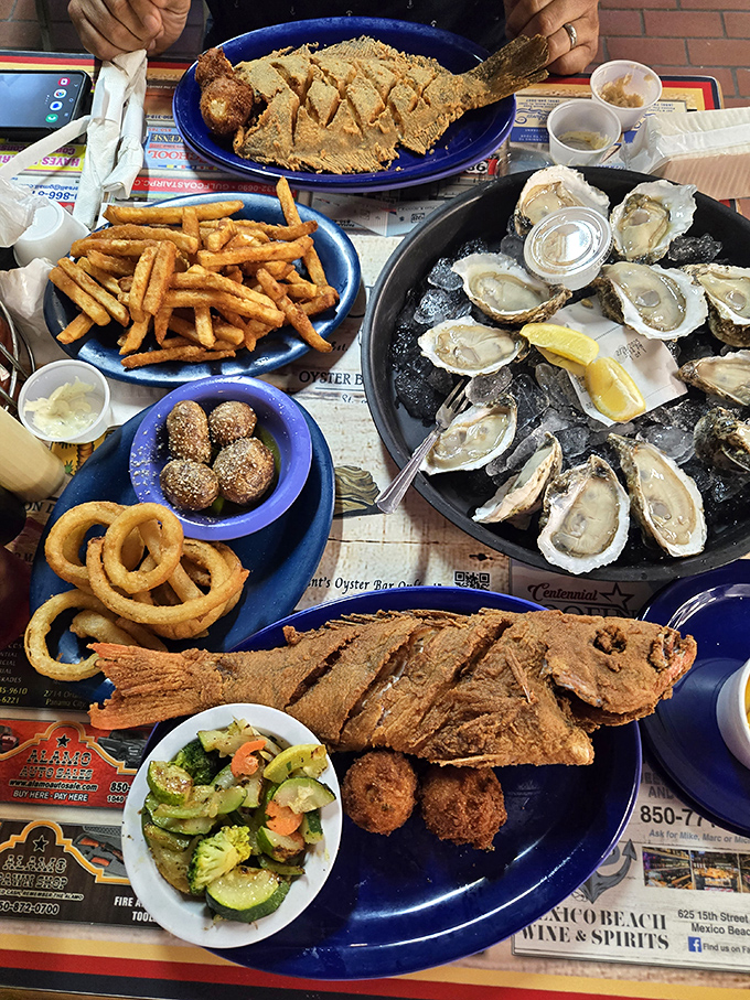 This isn't just a meal; it's a seafood celebration where fried fish, fresh oysters, and hushpuppies gather for the ultimate Florida feast.