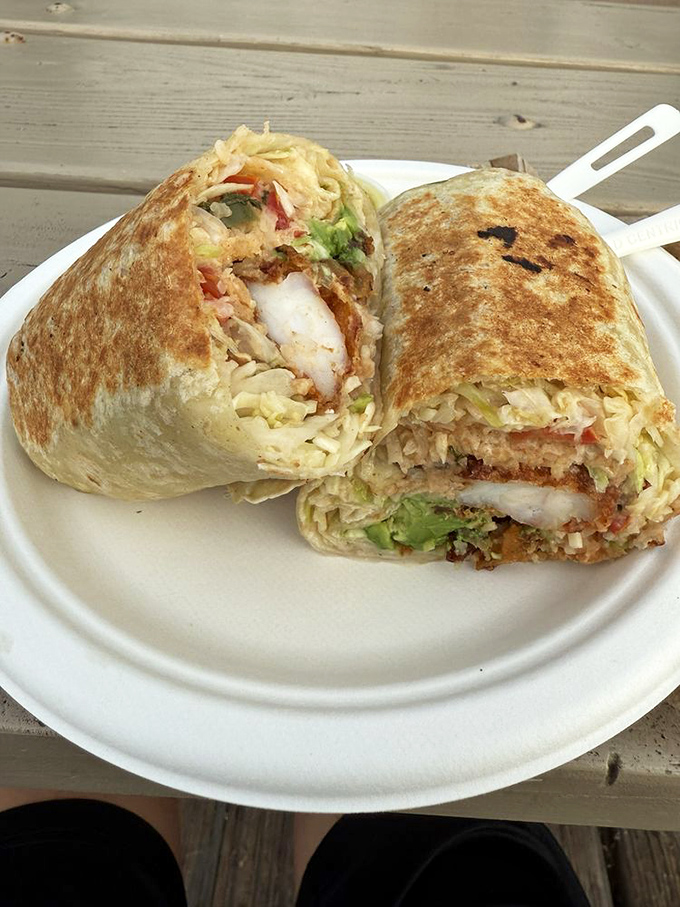 This isn't just a seafood burrito—it's edible architecture where each layer plays its part in a symphony of textures and flavors.