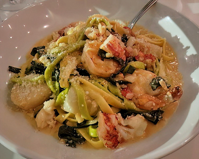 Not all heroes wear capes&mdash;some twirl on forks. This seafood fettuccine combines pasta, fresh seafood, and vegetables in a harmony that would make Neptune weep.