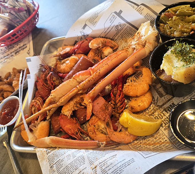 Seafood boil heaven! Crab legs, shrimp, and crawfish piled high like treasure from a delicious shipwreck. The side dishes are merely supporting actors in this ocean drama.