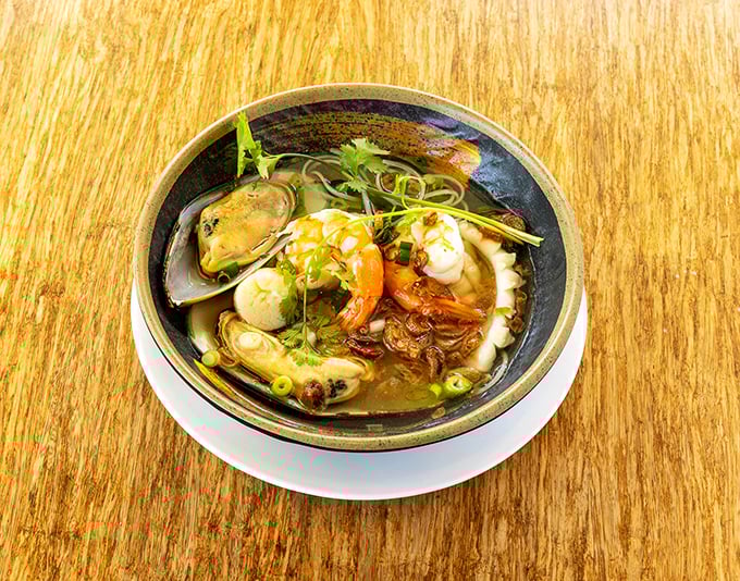 Behold the legendary seafood noodle soup! Plump shrimp, tender mussels, and delicate noodles swim in a broth so flavorful it should be bottled and sold as perfume.