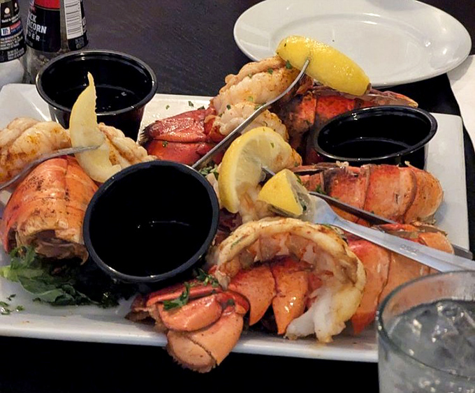 Neptune himself would approve of this seafood platter, where lobster tails and jumbo shrimp are dressed in their Sunday best, accessorized with lemon wedges and dipping sauces.