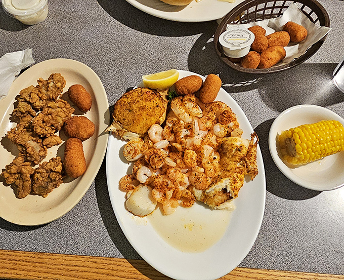 Seafood platters that make you want to send a thank-you note to the ocean. Golden hush puppies stand guard around perfectly fried treasures from the deep.