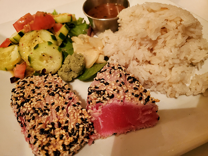 The legendary sesame-crusted tuna arrives like edible art&mdash;ruby-red center, crunchy seed coating, and sides that know their supporting role.