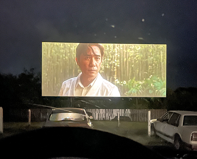 When darkness falls completely, the massive screen transforms into a window to other worlds. Even action stars seem larger against the night sky.