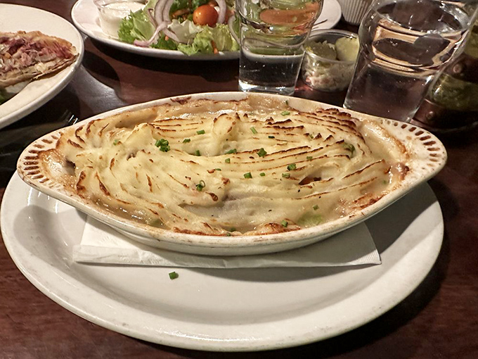 Behold the legendary Shepherd's Pie in all its golden-topped glory. That perfect browning on the potato peaks? That's what dreams are made of.