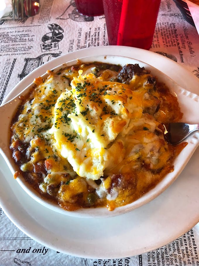 Behold the legendary Shepherd's Pie in all its glory &ndash; a bubbling masterpiece of savory filling crowned with a cloud of buttery mashed potatoes.