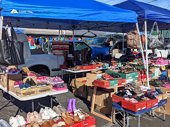 Shoe heaven exists, and it's organized in cardboard boxes under a blue canopy. Cinderella would have saved herself a lot of trouble here.