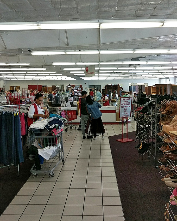 Thrift store rush hour&mdash;where savvy shoppers know the early bird gets the vintage worm. Notice the shopping carts already filling with potential treasures.
