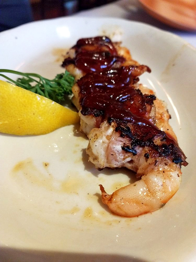 Bacon-wrapped shrimp isn't just food&mdash;it's poetry on a plate, with that perfect char telling a story of flame-kissed perfection.