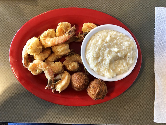 Golden-fried shrimp nestled beside creamy grits and hush puppies&mdash;a trio so perfect together they should form a band.
