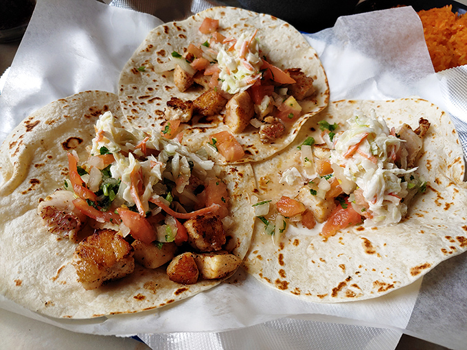 These shrimp tacos aren't just a meal, they're an event. Fresh cabbage slaw and perfectly seasoned seafood create a harmony that Mozart would envy.