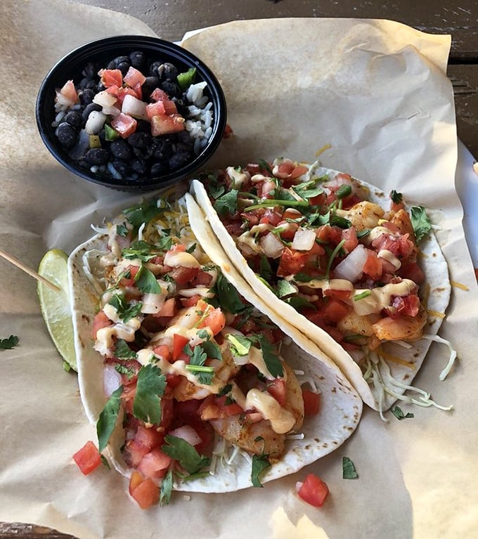 These shrimp tacos aren't just a meal; they're a beach vacation wrapped in a tortilla, with black beans playing the perfect supporting role.