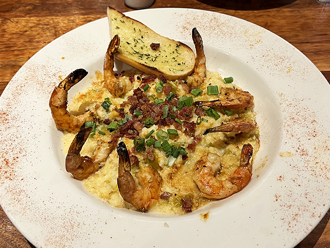 These shrimp and grits aren't just a meal&mdash;they're a Southern hug on a plate. Bacon bits and green onions add the perfect finishing touch.