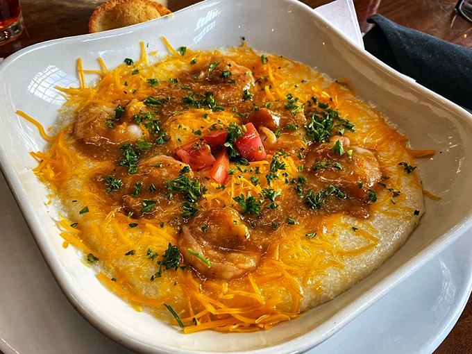 Behold the shrimp and grits that launched a thousand road trips &ndash; creamy, cheesy perfection worth every mile.