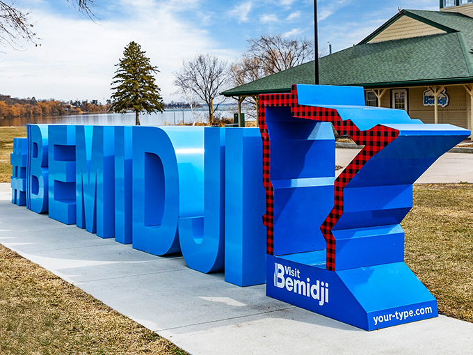 The "Visit Bemidji" sign combines Minnesota's outline with classic northwoods plaid&mdash;like if L.L. Bean designed state welcome signs.