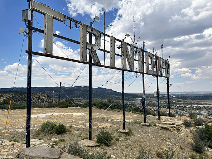 The iconic Trinidad sign perches above the city like a Hollywood-style landmark, offering panoramic views that make hikers forget their burning calves.
