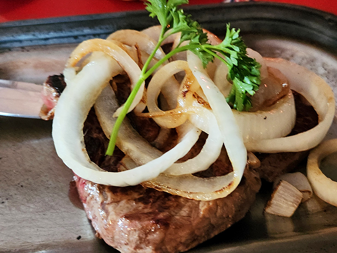 Behold the star attraction: a perfectly seared sirloin topped with sweet onions. This isn't just steak&mdash;it's edible Wisconsin heritage.