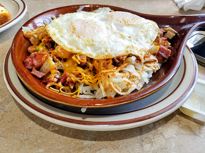 Behold the breakfast skillet&mdash;where hash browns, eggs, and various breakfast meats hold their morning summit conference under a melty cheese canopy.