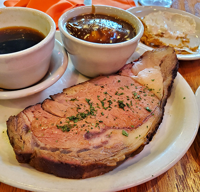 Behold the star attraction: prime rib with a smoke ring so perfect it could make a pitmaster weep. This isn't just meat; it's a carnivore's sonnet.