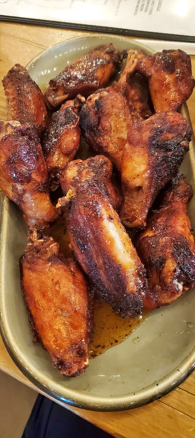 These wings aren't just smoked, they're transformed &ndash; each one a burnished trophy of patience, spice, and fire-kissed perfection.