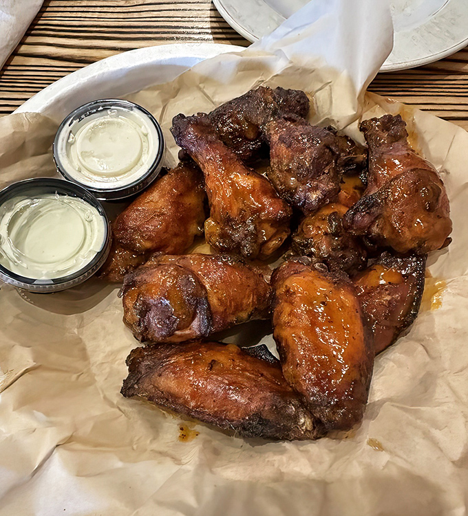 These smoked wings aren't just food; they're a religious experience. Crispy, smoky, and served with cooling dips that provide the perfect counterpoint.