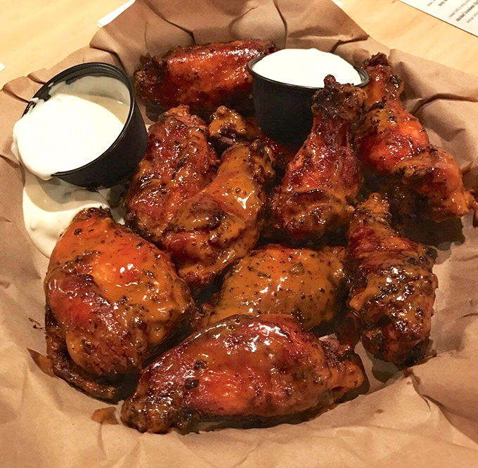 These wings aren't just smoked; they've attended a semester abroad at Flavor University. That glistening sauce clings to each one like it's afraid of abandonment.