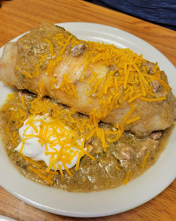 This smothered burrito isn't just breakfast—it's an edible hug. Green chile sauce and melted cheese create the morning masterpiece you didn't know you needed.