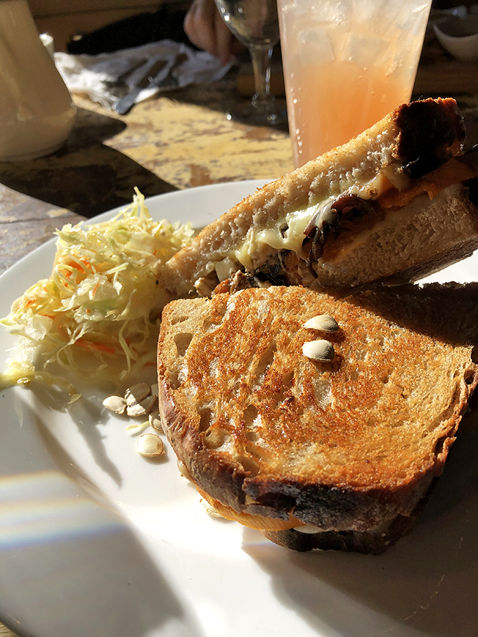 That golden-brown sourdough isn't just toast&mdash;it's the supporting actor that steals the show, with seeds adding texture to an already perfect canvas.