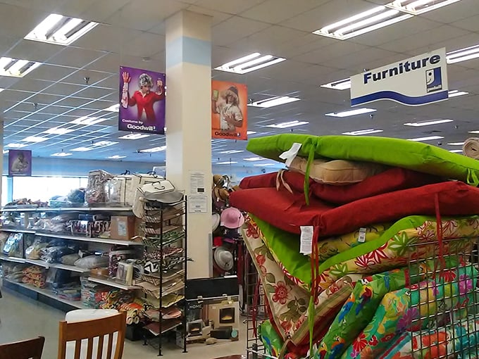 Colorful cushions stacked like pancakes next to furniture that's seen a few stories but is ready to star in yours.