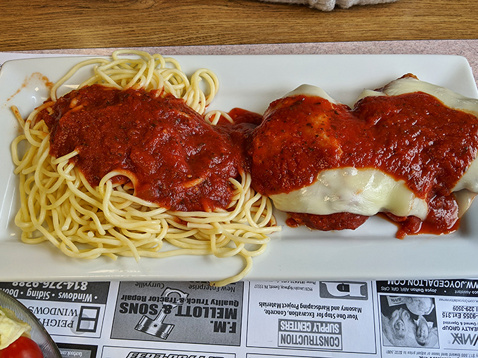 Behold the star attraction: spaghetti with sauce so rich and vibrant it could make an Italian grandmother nod in silent approval.