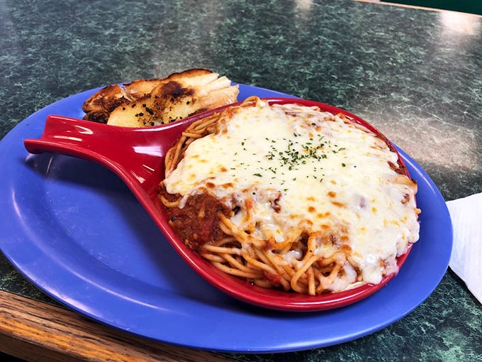 Behold the star attraction: baked spaghetti that defies diner logic with its bubbling cheese canopy and hearty sauce. Worth every carb-laden bite!