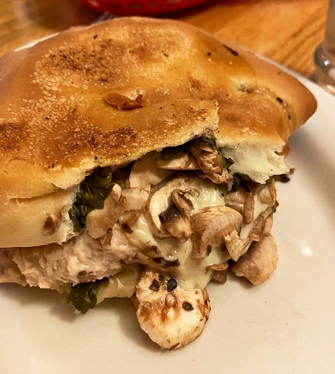 The legendary spinach pie in all its glory—where flaky dough meets savory filling in a relationship more perfect than any Hollywood romance.