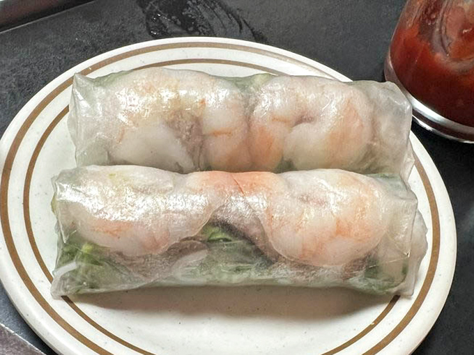 These summer rolls showcase plump shrimp through translucent rice paper like aquatic treasures in display cases. Nature's perfect appetizer, no cooking required.