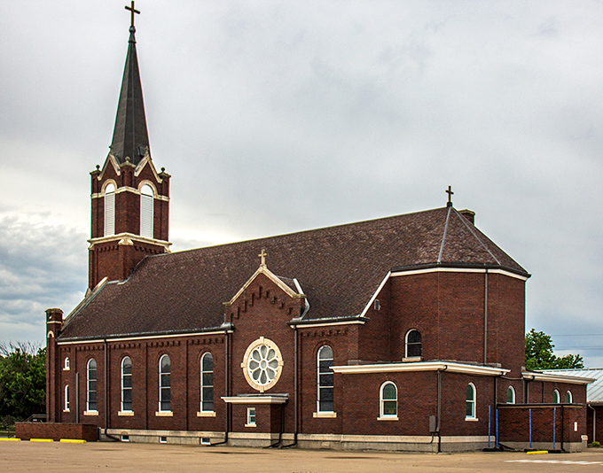 St. Andrew's Catholic Church stands as a brick testament to faith and community, where Sunday services don't require a second mortgage for parking.