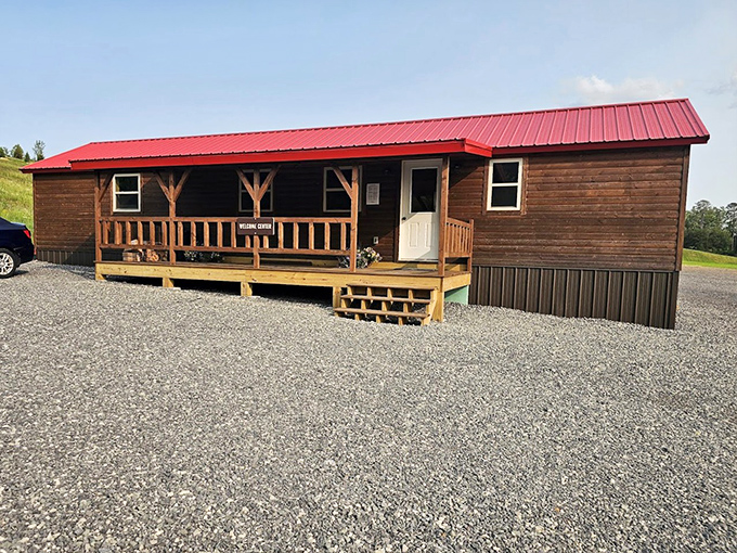 This rustic cabin with its inviting porch practically whispers, "Put down your phone and stay awhile." Challenge accepted!