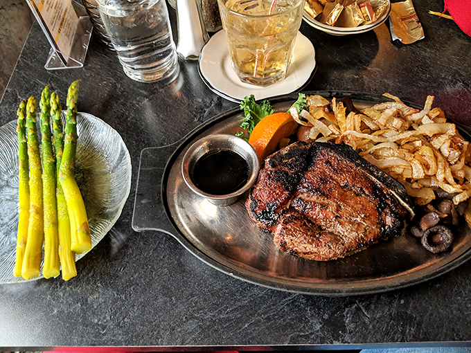 Behold the star of the show: a perfectly seared steak with asparagus standing at attention. This isn't dinner&mdash;it's edible artwork.