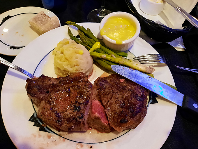 Behold the star of the show: a perfectly seared steak with that textbook pink center that makes carnivores weak at the knees.