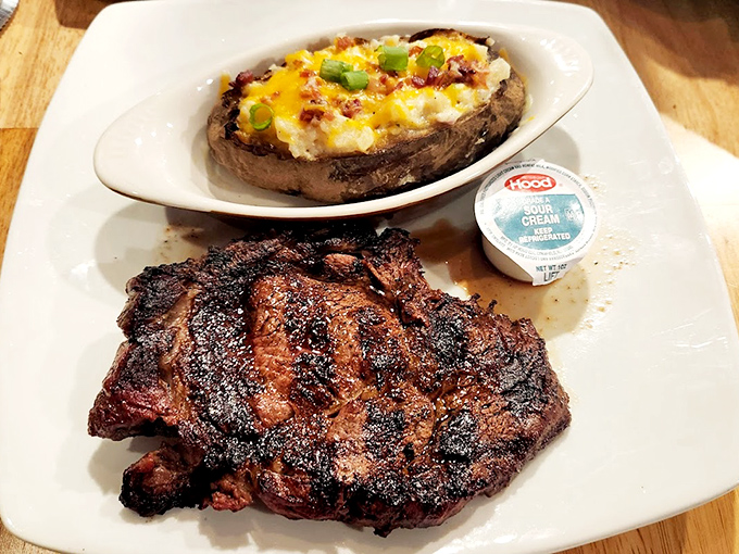 A perfectly charred steak alongside a loaded baked potato&mdash;proof that sometimes the simplest combinations are culinary poetry in motion. 