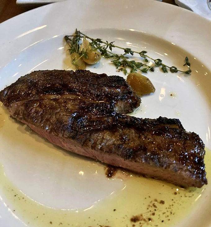 Behold: meat perfection. This perfectly seared steak with its glistening crust and rosy interior is what food dreams are made of&mdash;no Instagram filter required.