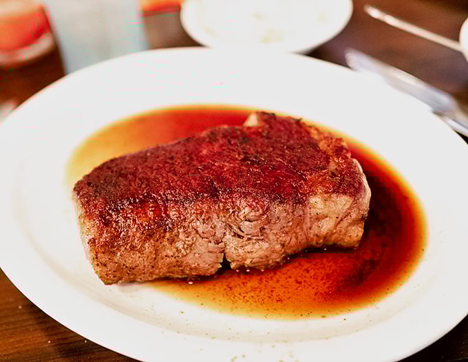 This isn't just a steak&mdash;it's a sermon on simplicity. Perfect sear, rosy interior, and a pool of jus that demands to be sopped up.