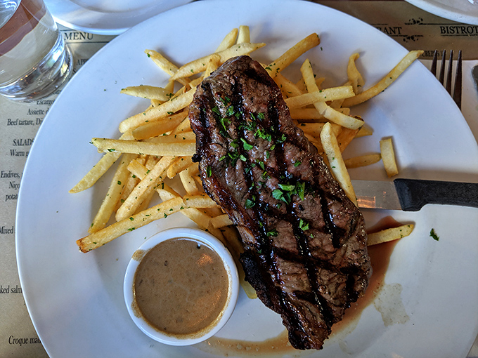 The steak frites that launched a thousand sighs. Perfectly seared beef alongside golden fries creates the kind of plate that makes conversation stop and eyes close in bliss.