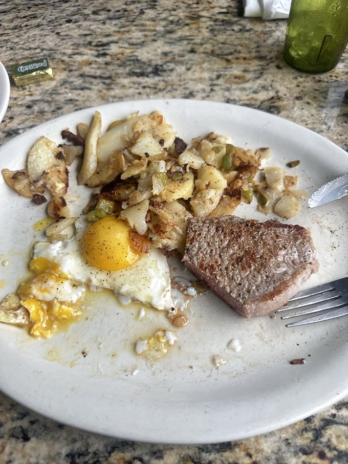 Breakfast alchemy at its finest: perfectly sunny eggs, home fries with just the right crisp, and scrapple that would make any Pennsylvanian proud.